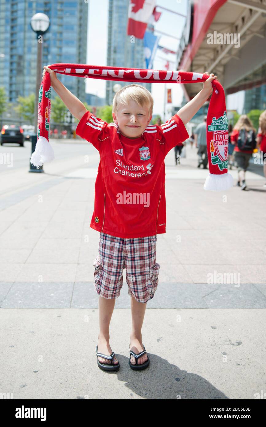 A little Liverpool supporter outside The Rogers Centre in Toronto ...
