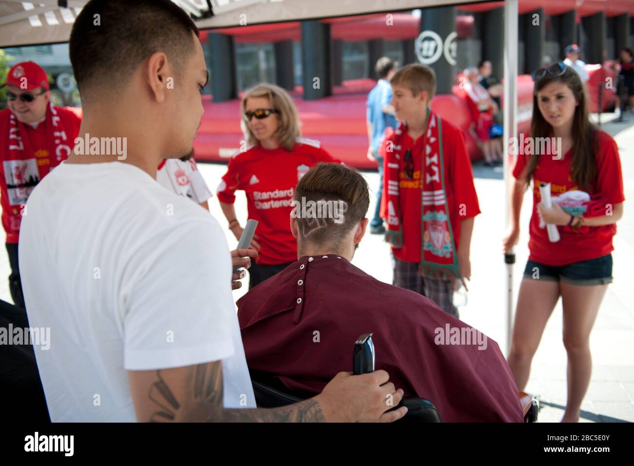 Liverpool supporter gets a special LFC haircut outside the Rogers ...