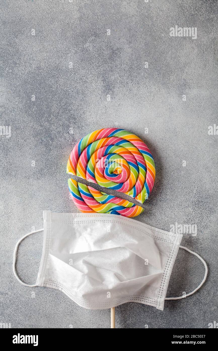 multi colored lollipop covered medical mask top view flat lay copy ...