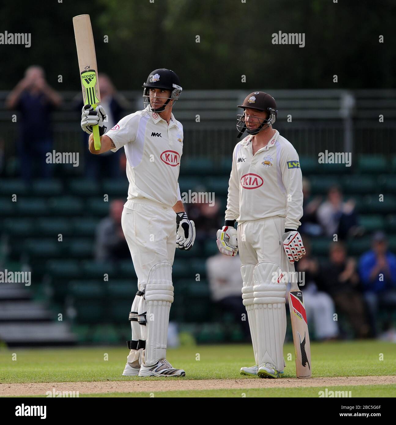 Surrey's Kevin Pietersen (left) celebrates with Gareth Batty after ...