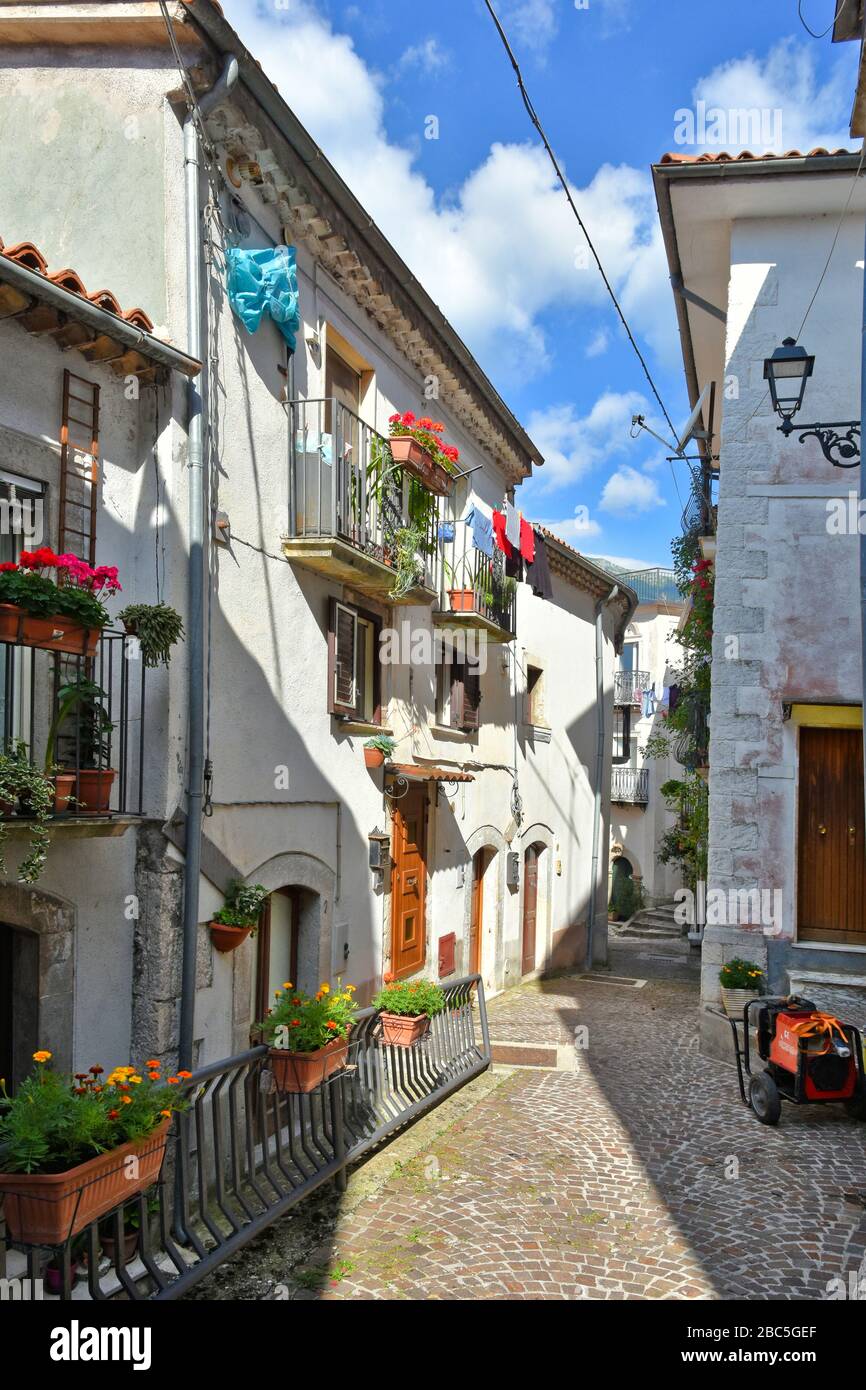 A narrow street between the houses of Pizzone, a village in the Molise ...