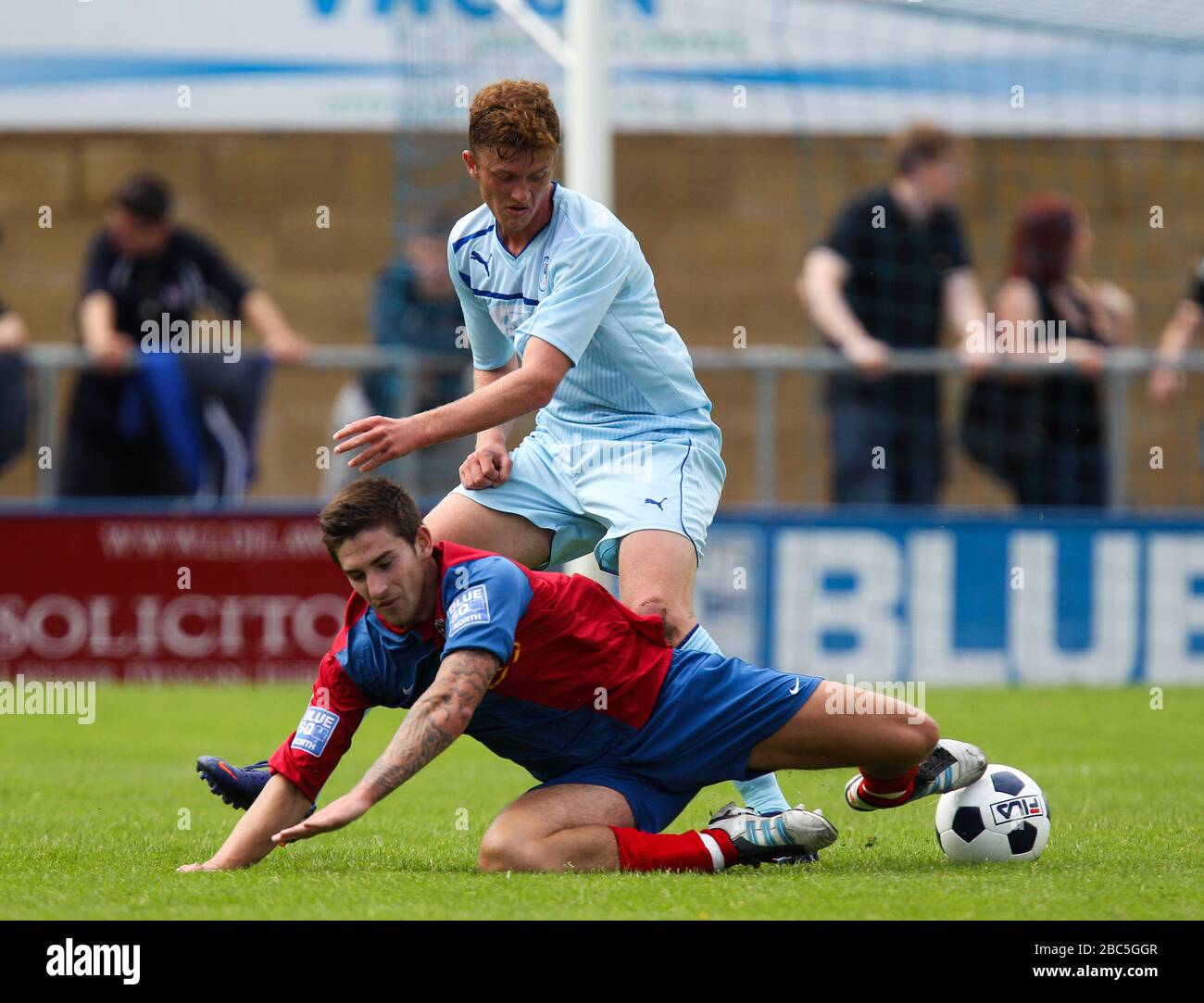 Hinckley United's Brodie Blankley battles for possession of the ball ...