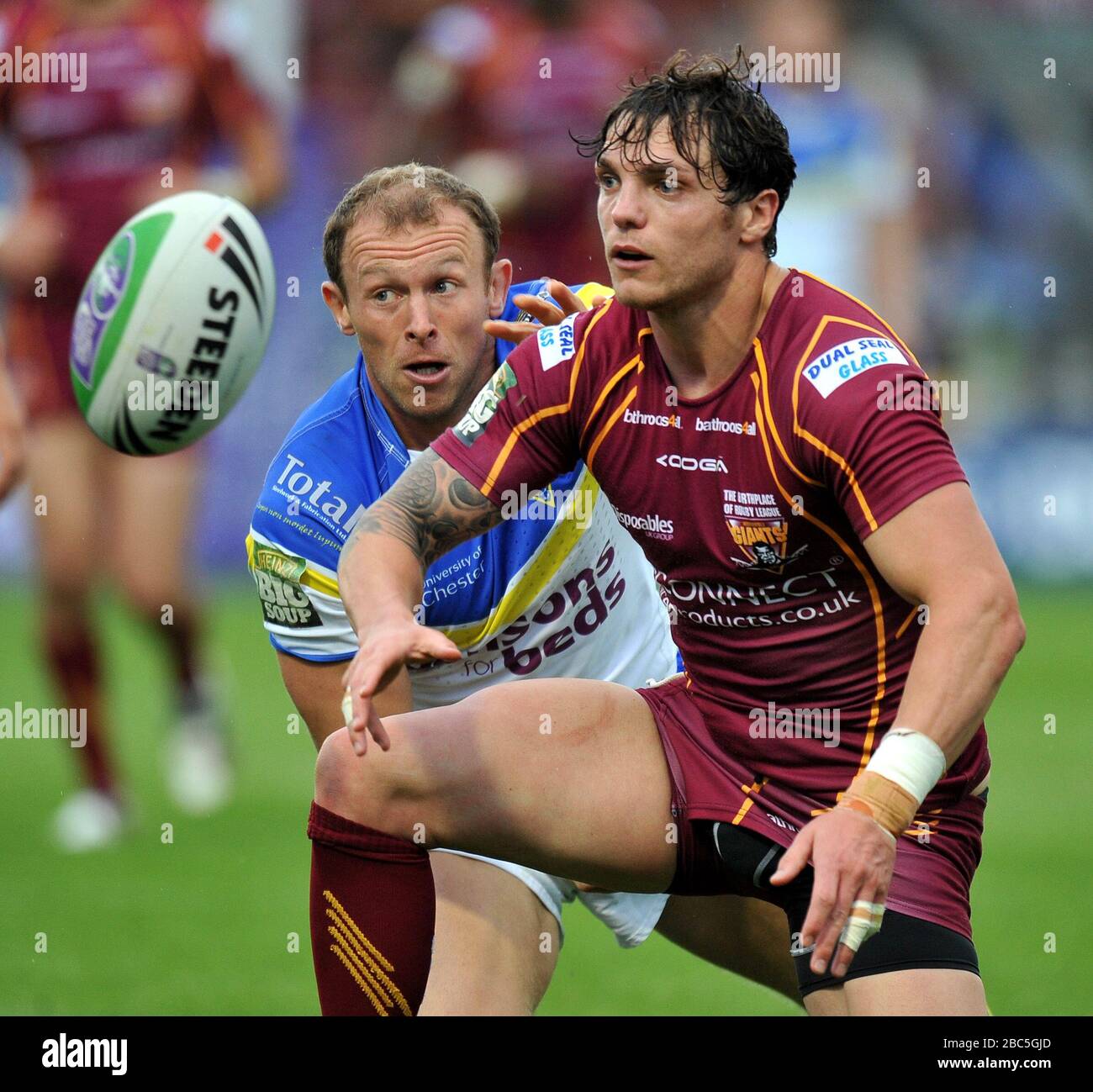 Warrington Wolves' Micky Higham and Huddersfield Giants' Scott Grix ...