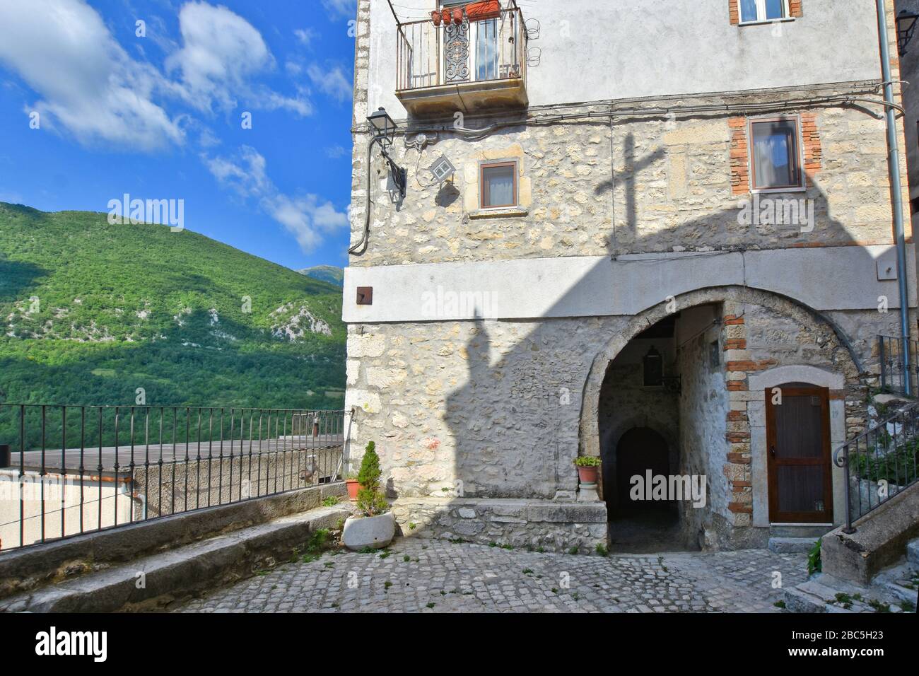 A narrow street between the houses of Pizzone, a village in the Molise ...