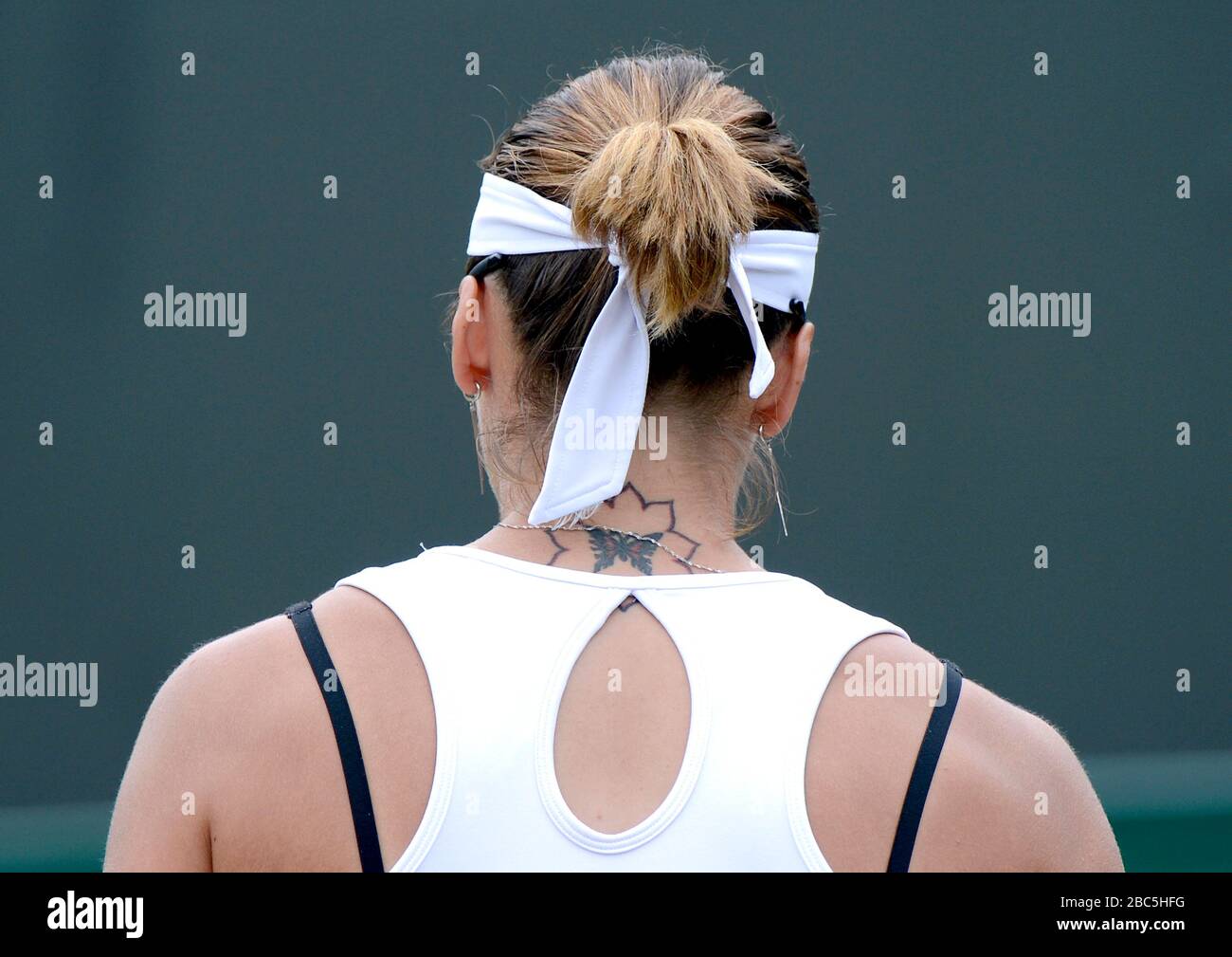 Kazakhstan's Yaroslava Shvedova shows a tattoo on her neck in her match ...
