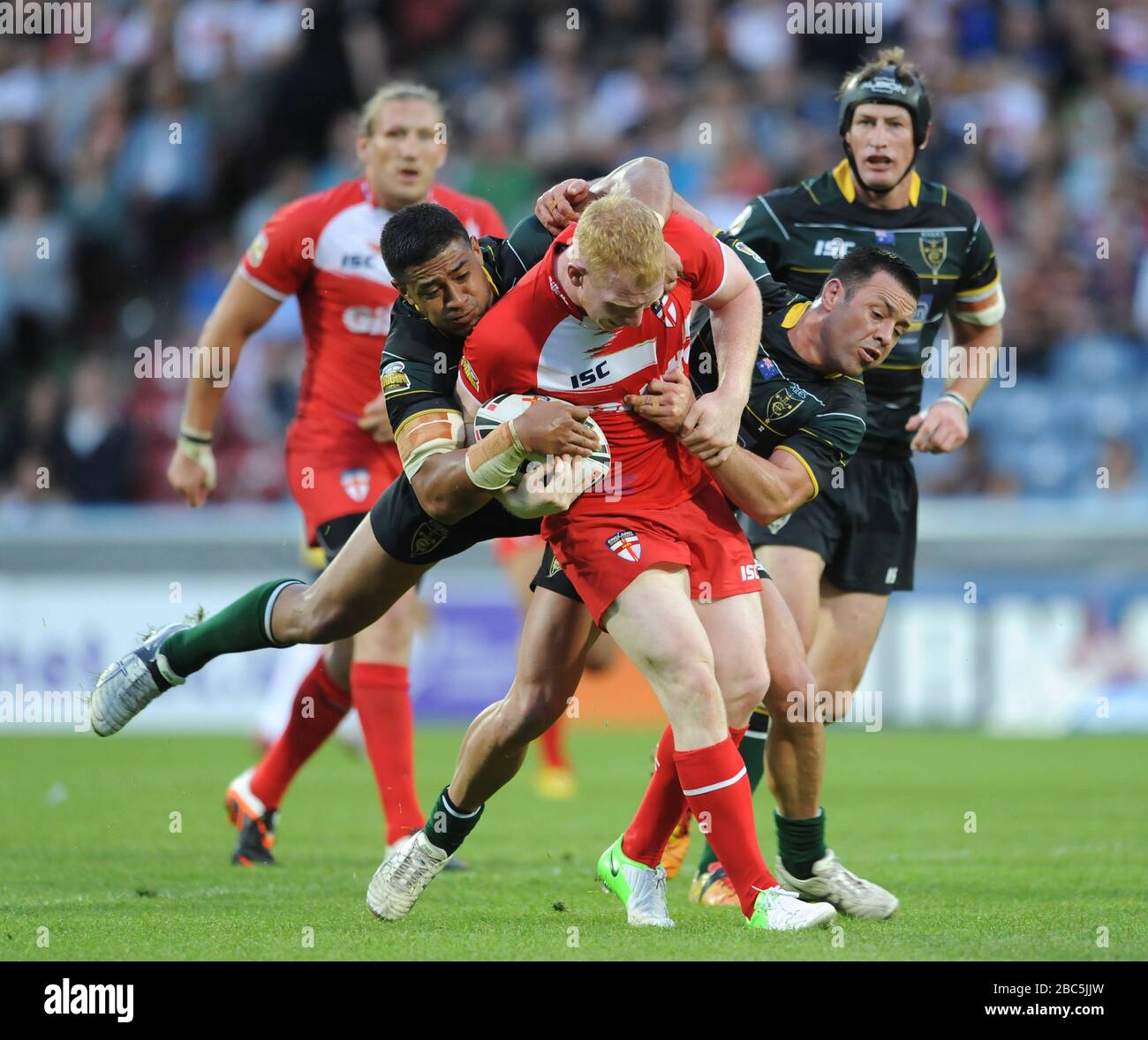 England's Liam Farrell is tackled by Exiles' Willie Manu and Lincoln Withers Stock Photo - Alamy