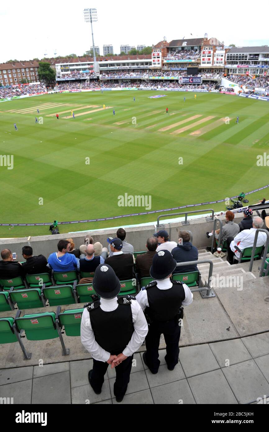 Police watch over the crowds and match action Stock Photo - Alamy
