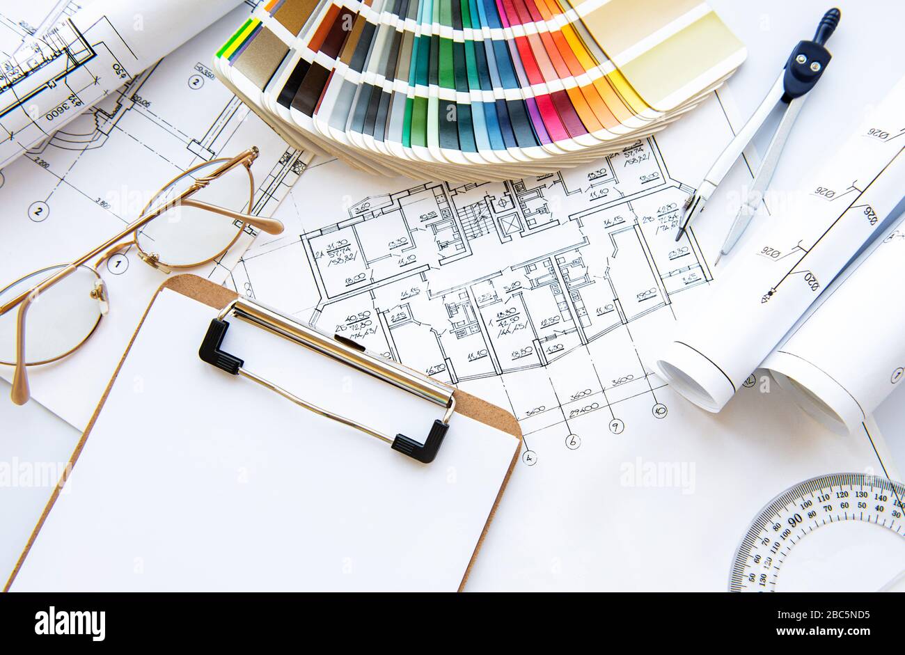 Architect workplace top view. Architectural project, blueprints ...