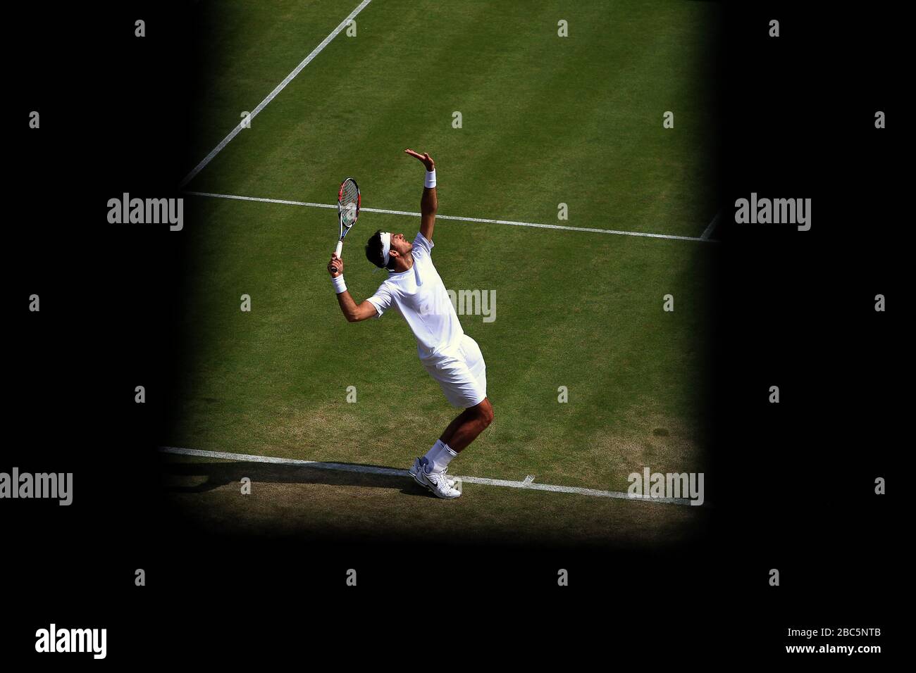 Argentina's Juan Martin Del Potro serves against Japan's Kei Nishikori ...