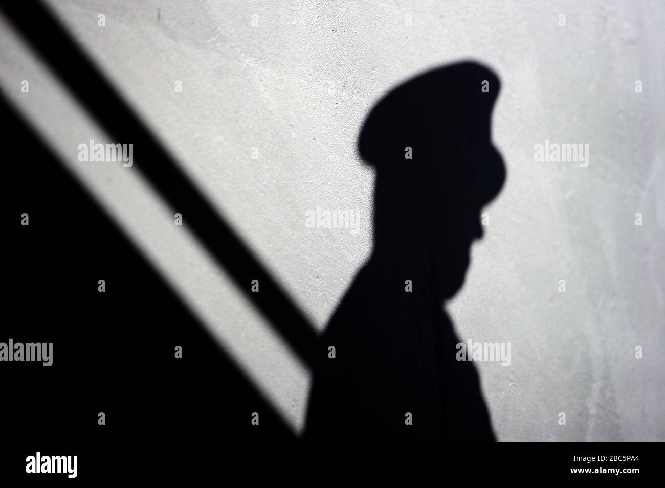Shadow of a Wimbledon security guard Stock Photo - Alamy