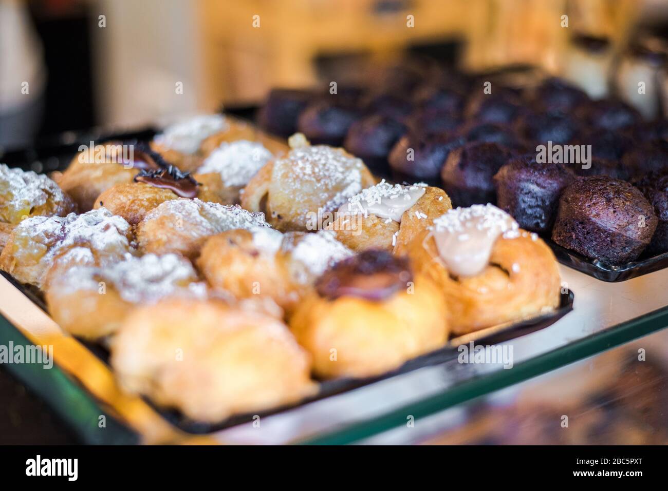 Pastry display with pastry desserts in a bakery Stock Photo - Alamy