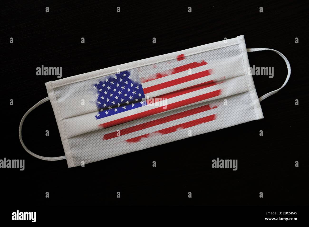 Medical mask with the image of the flag of the United States. Concept ...