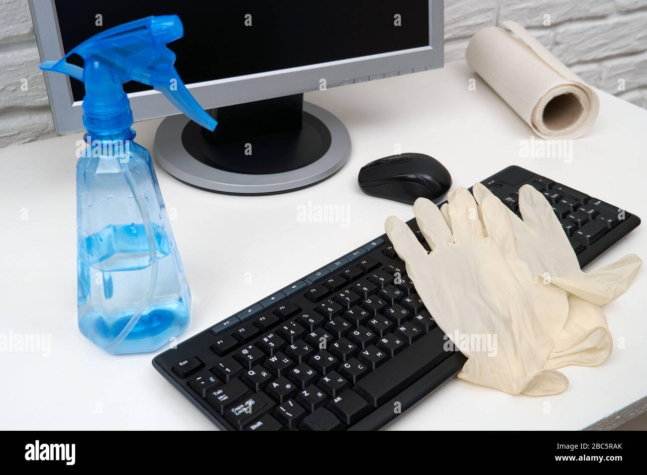 concept of cleaning or disinfecting the office - a businessman cleans ...