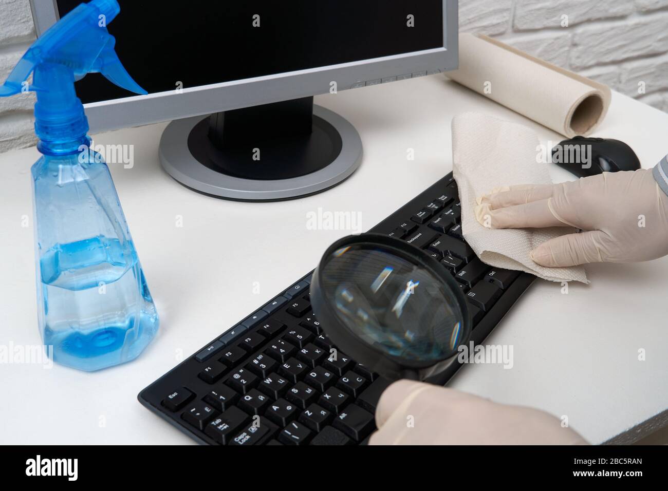 concept of cleaning or disinfecting the office - a businessman cleans ...