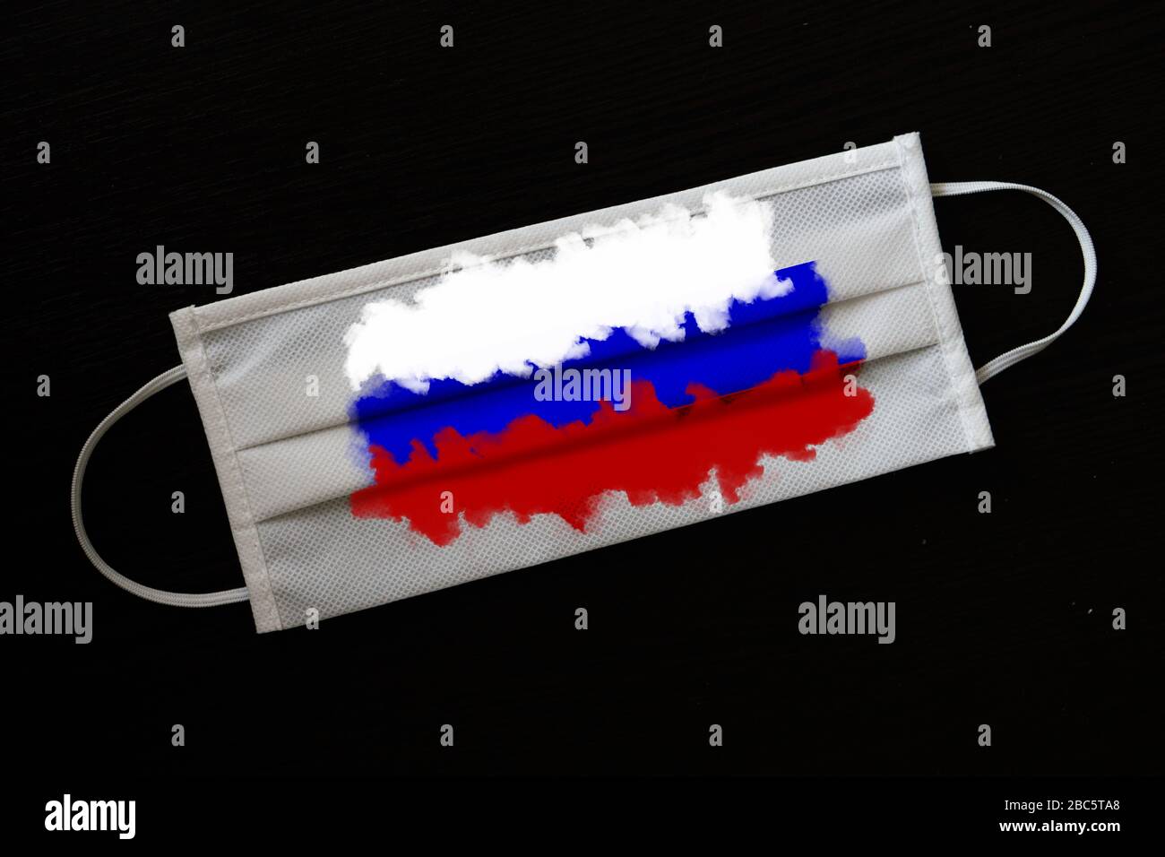 Medical mask with the image of the flag of the Russia. Concept of the ...