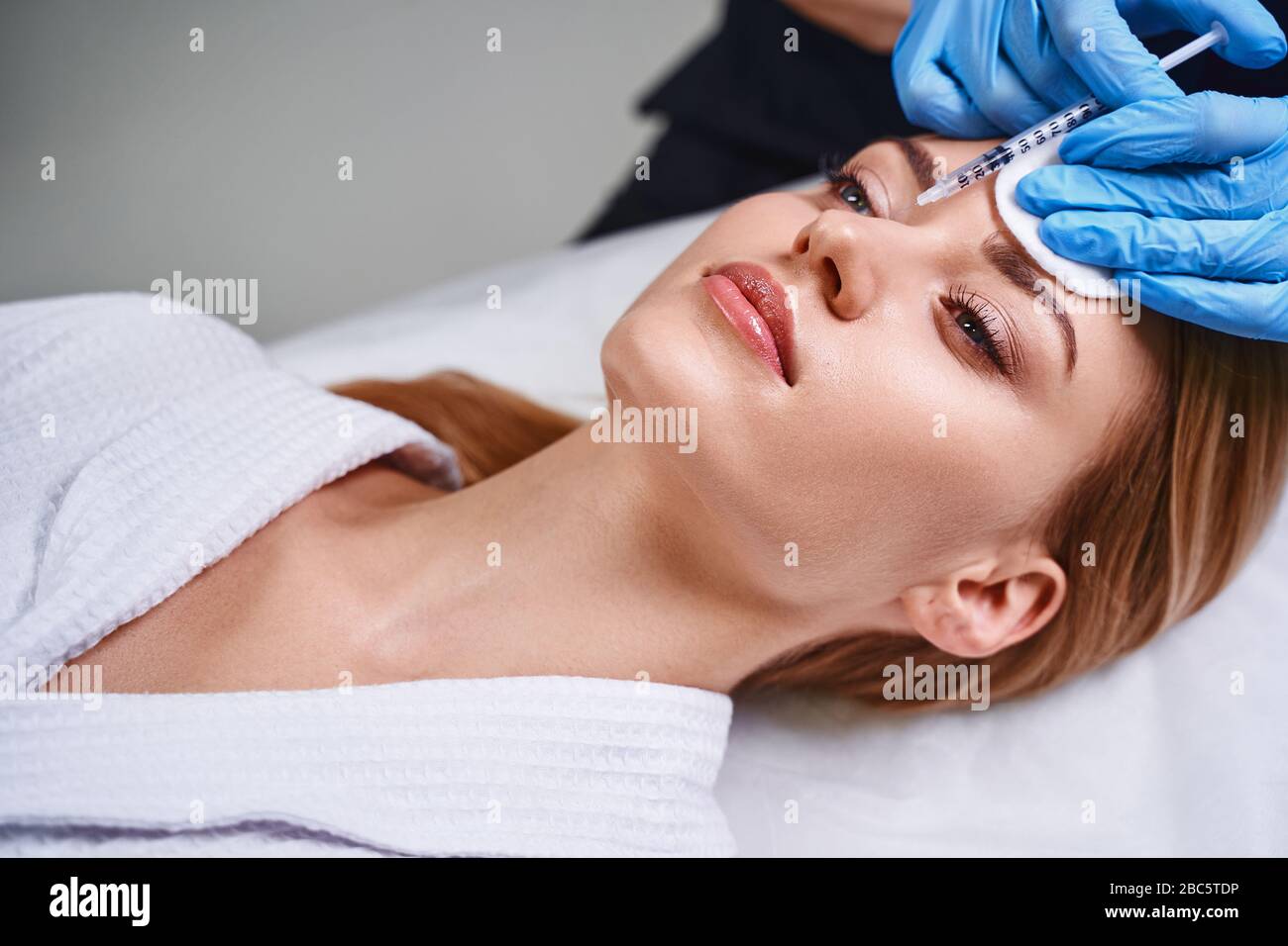 Female doing injections in salon stock photo Stock Photo - Alamy