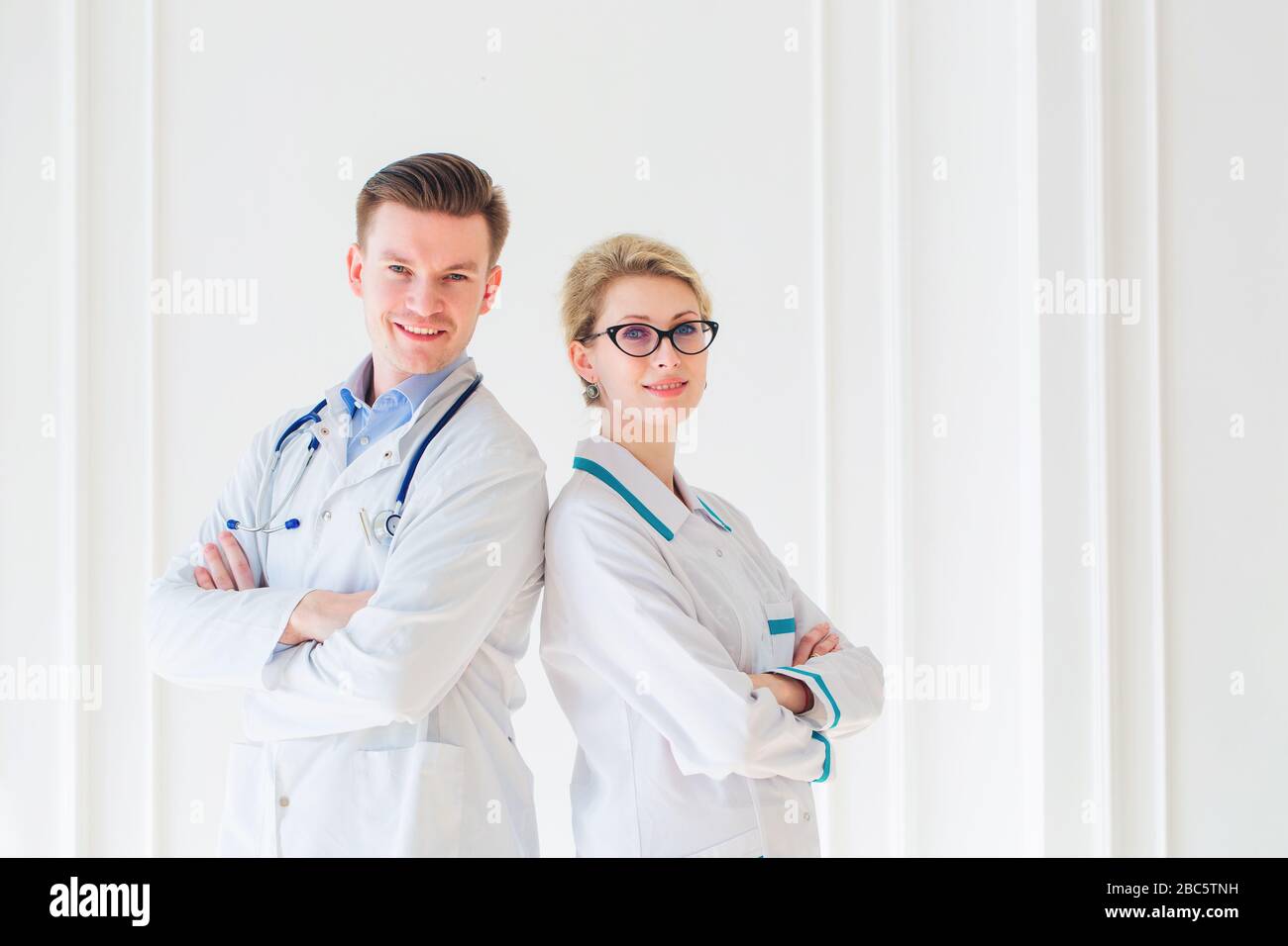 Portrait two young attractive doctors Stock Photo - Alamy