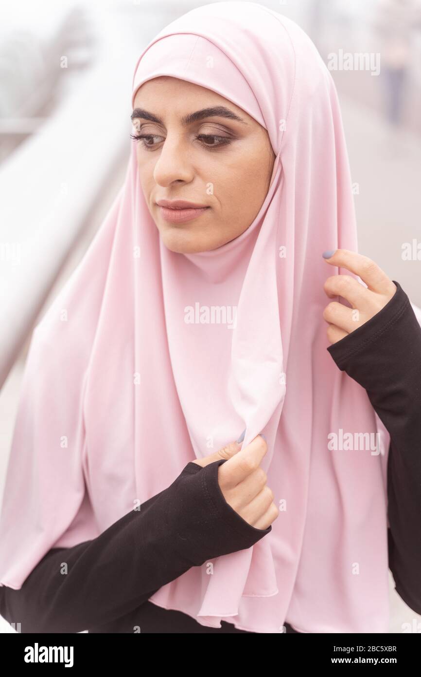 Thoughtful young Muslim lady outdoors stock photo Stock Photo - Alamy