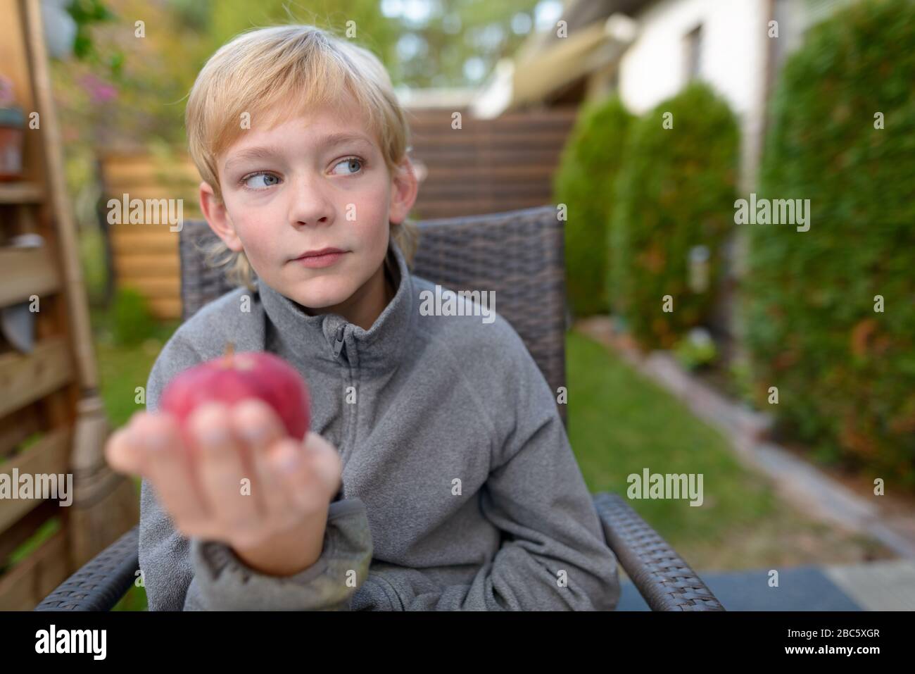 Boy garden thinking hi-res stock photography and images - Alamy