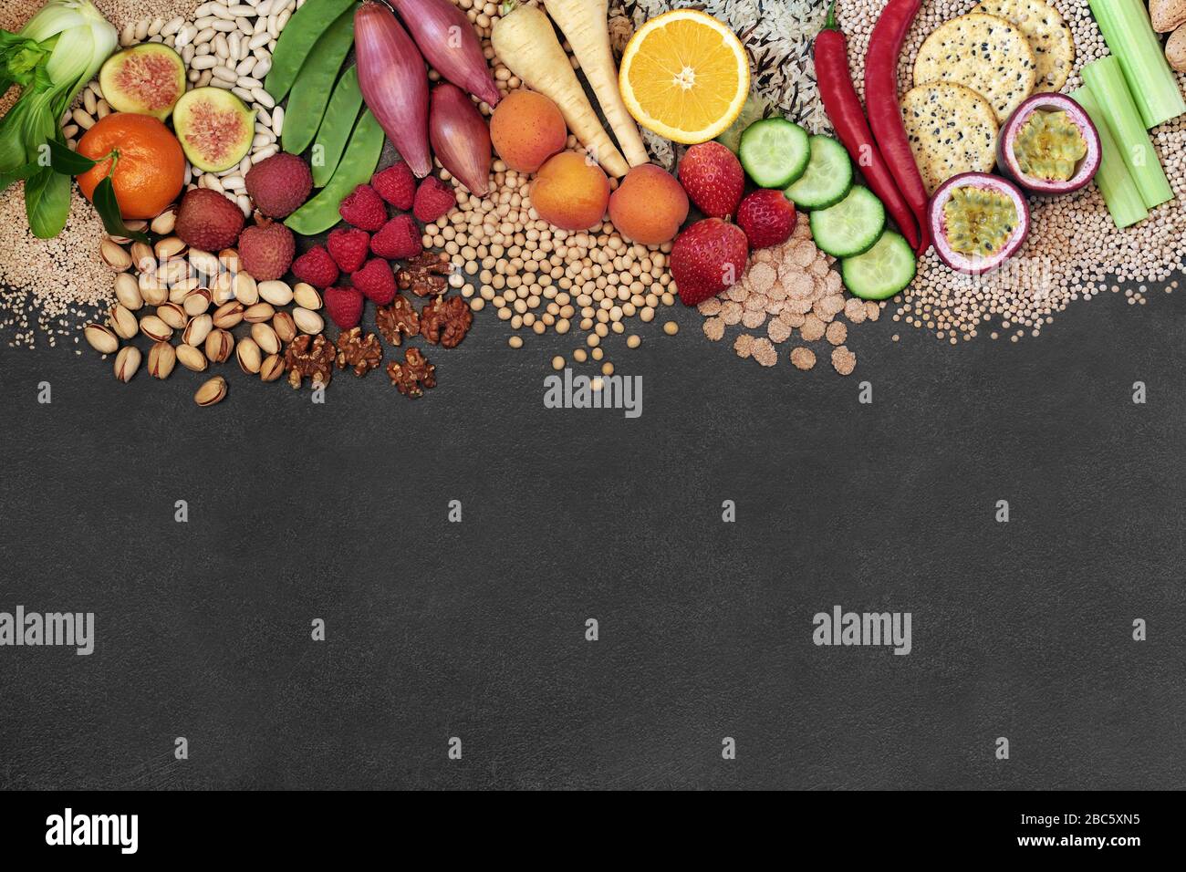 Vegan health food background border with a large selection of foods ...