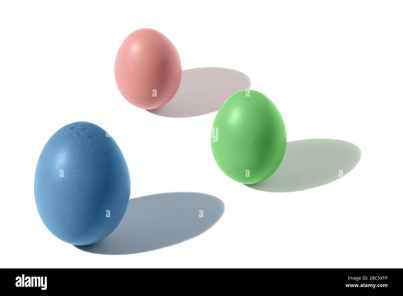 Three colored eggs with shade on white background, isometric ...