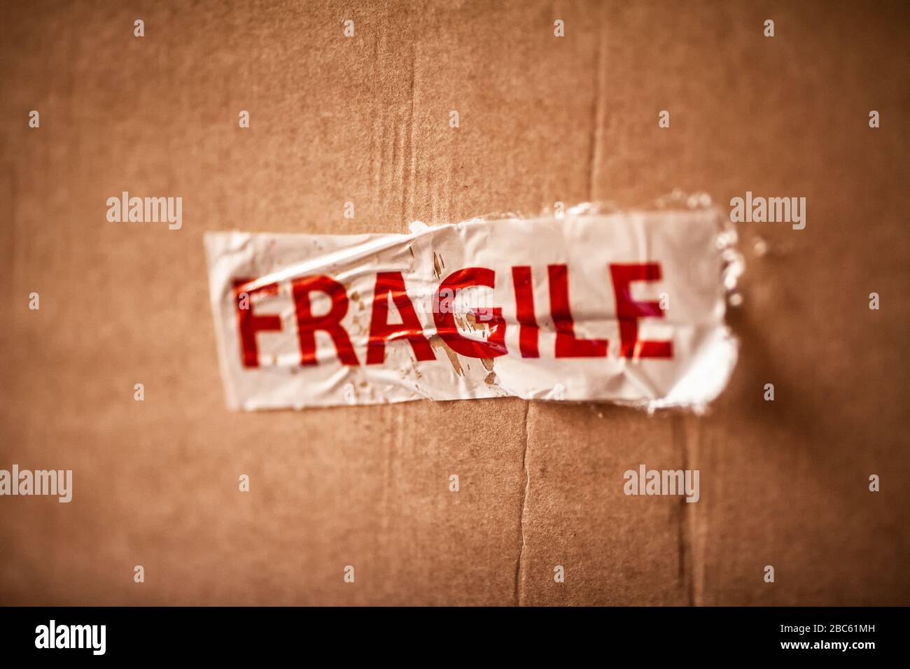 Fragile tape sticker red text on white backgroud Stock Photo - Alamy