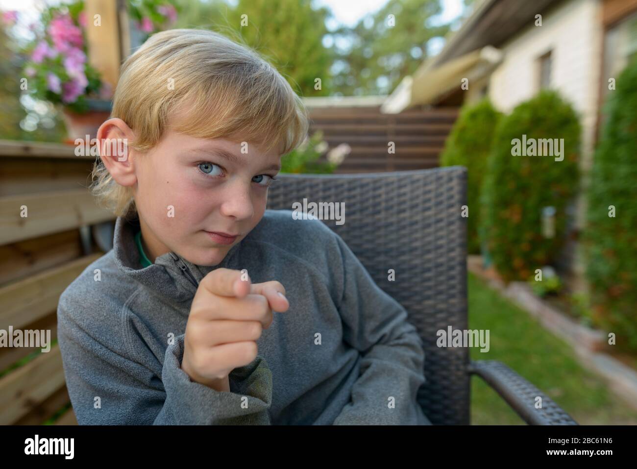 Pointing finger child house yard hi-res stock photography and images ...