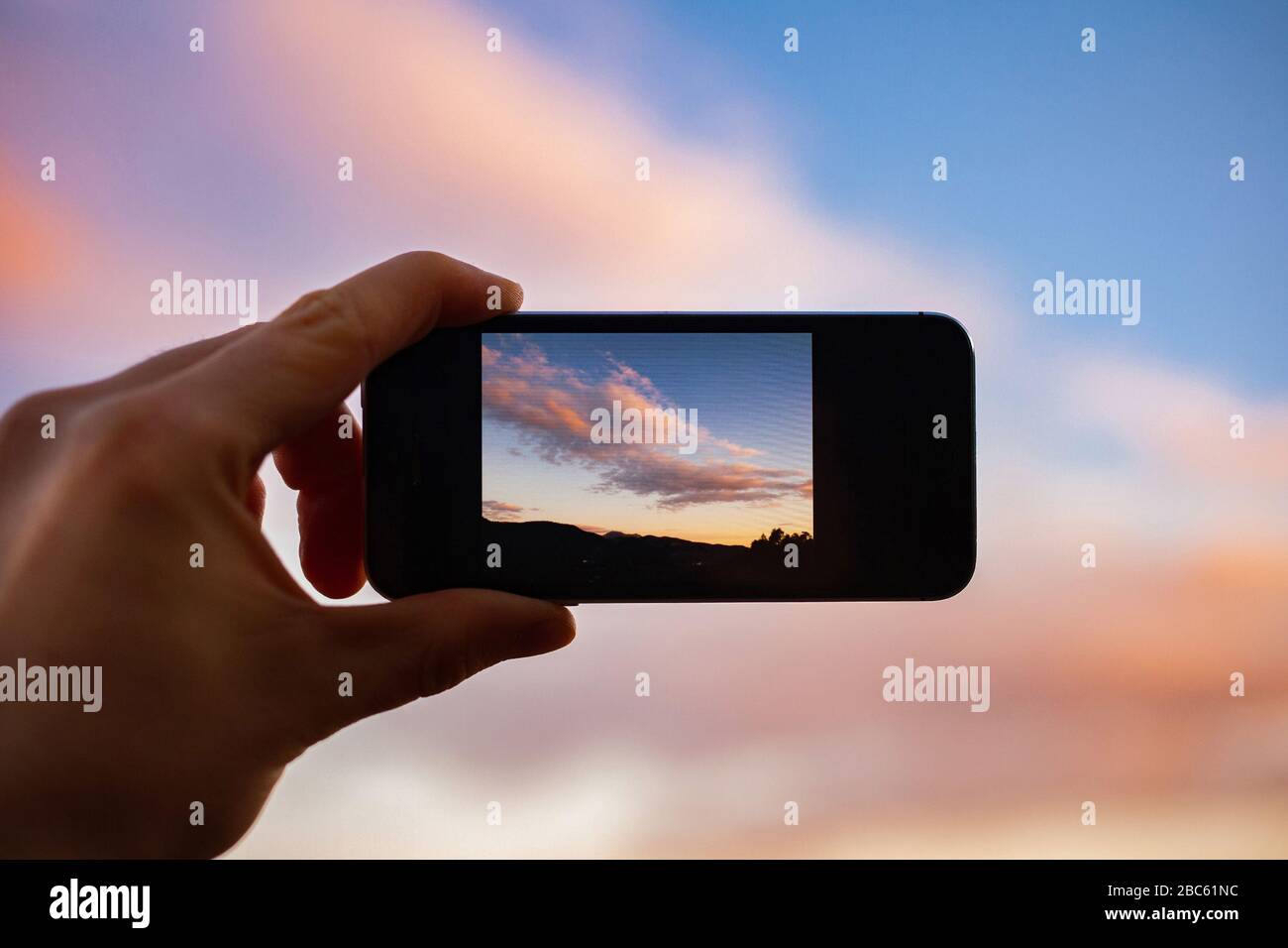 Simplicity - clouds seen through mobile phone screen Stock Photo - Alamy