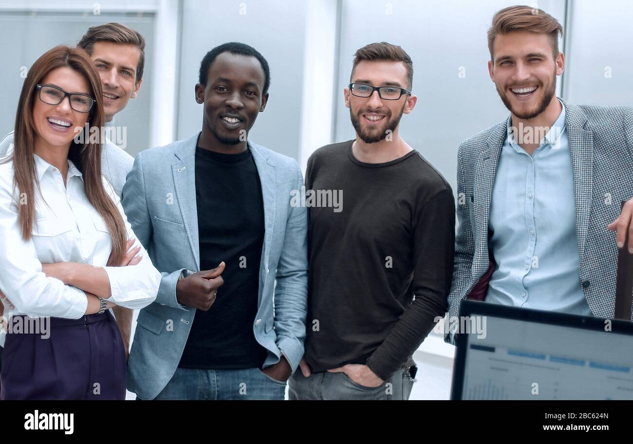 group of employees standing in the office Stock Photo - Alamy