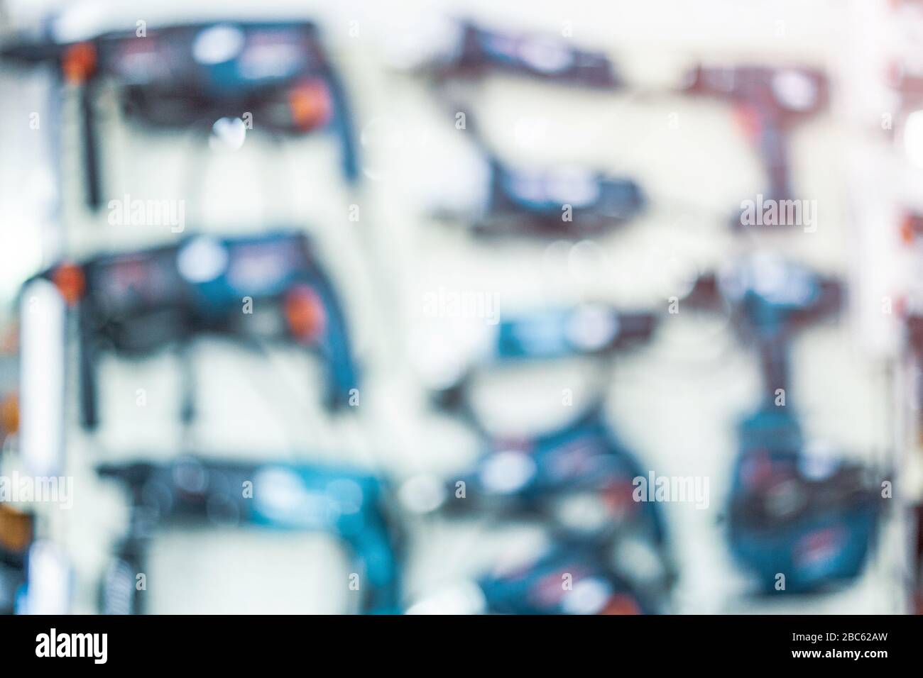 Power tools blurred background hardware store Stock Photo - Alamy