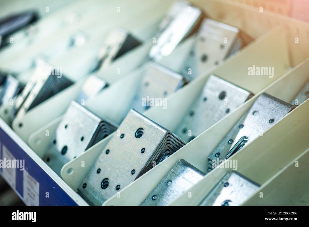 Steel zinc joining tie plates in hardware store shelf, different sizes ...