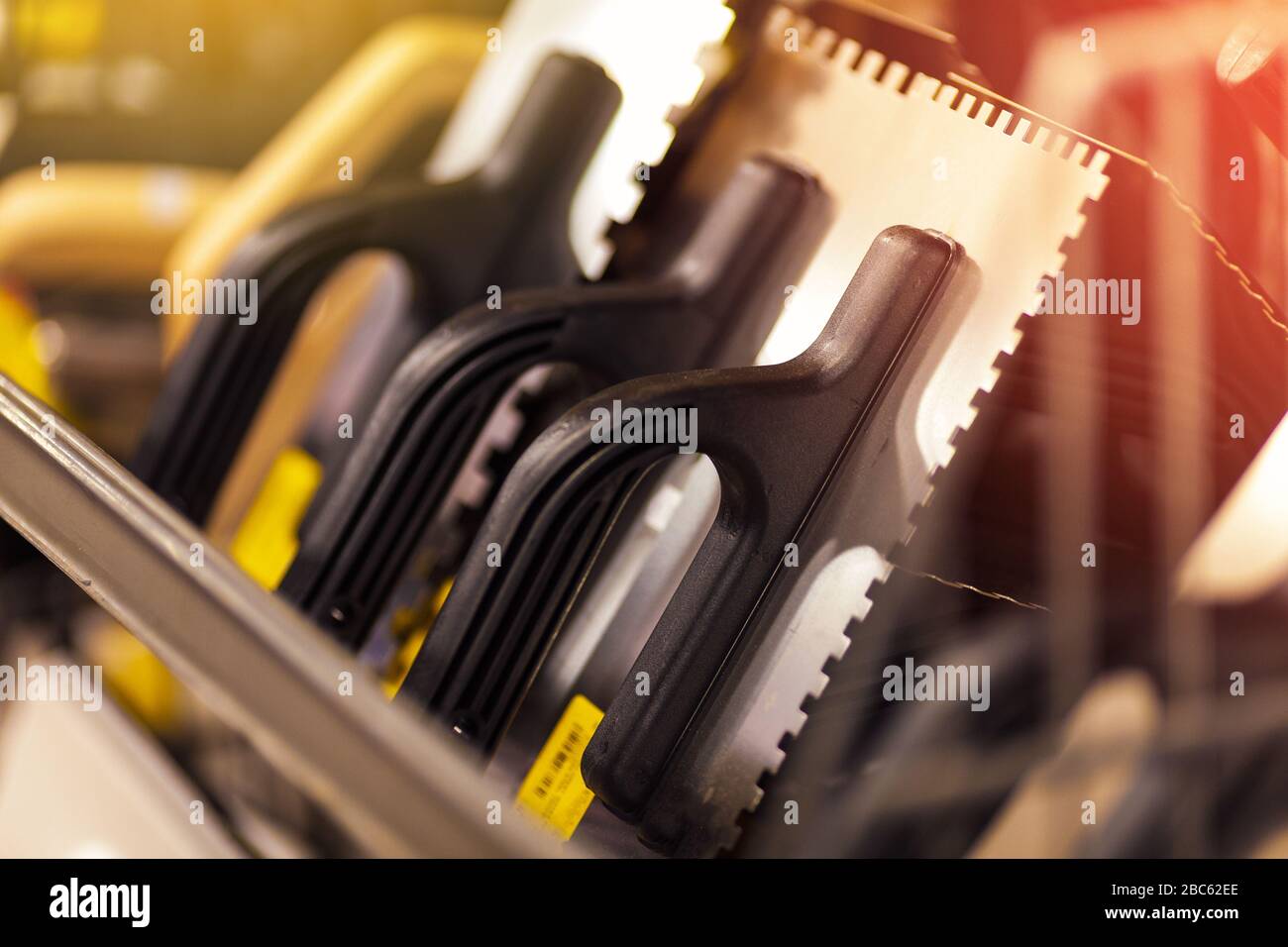 Notch trowel on hardware store shelf Stock Photo - Alamy