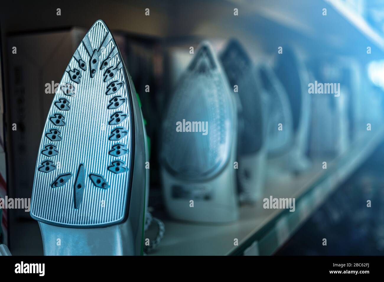 Steam laudry clothes iron on super market shelf Stock Photo - Alamy