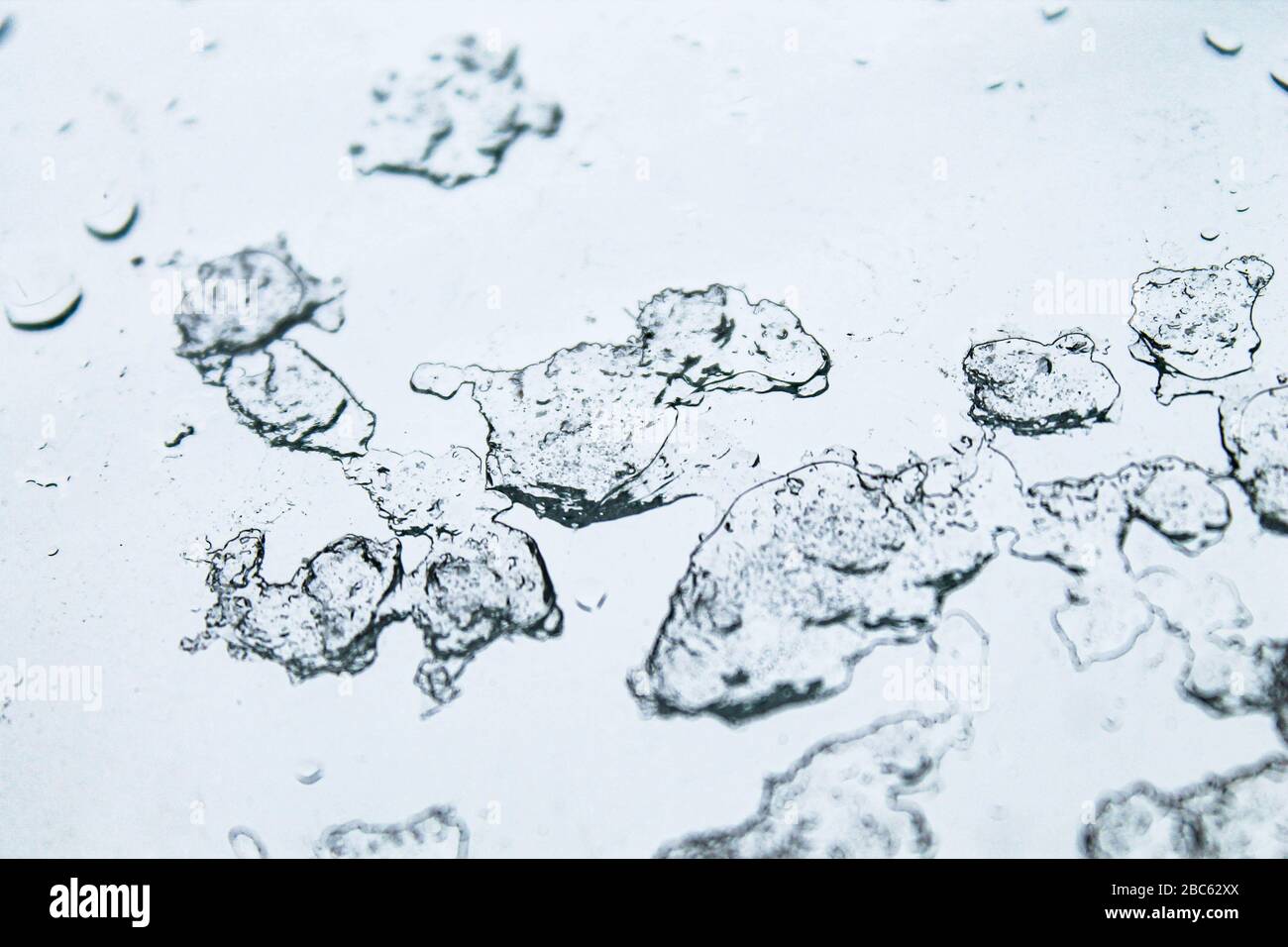 Snow on the window. Frozen and melted snow on the glass. Snow Stock ...