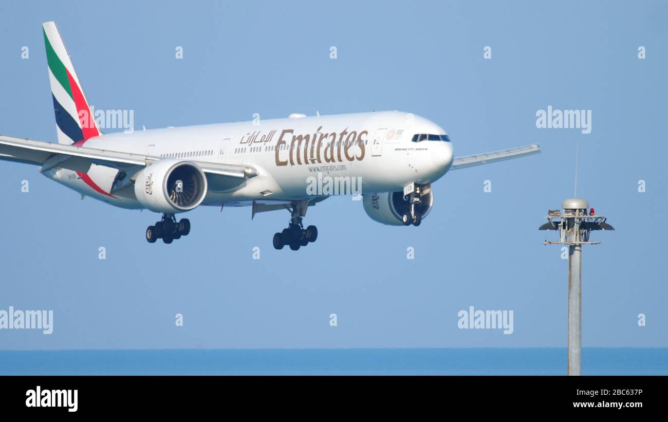 Emirates Boeing 777 over ocean Stock Photo - Alamy
