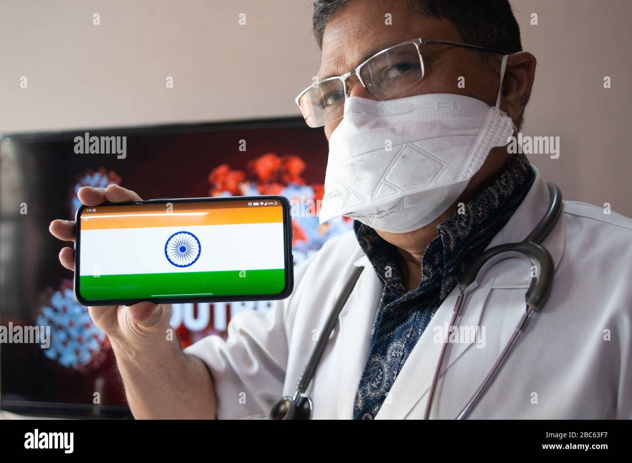 The indian flag help by a doctor wearing his uniform Stock Photo - Alamy