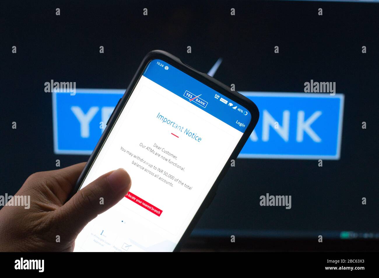 A mobile logged into the yes bank mobile application infront of the yes ...