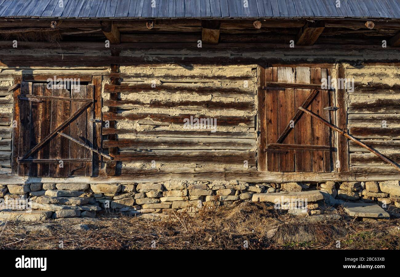 House built from rocks, wood and clay, old traditional Romanian barn ...