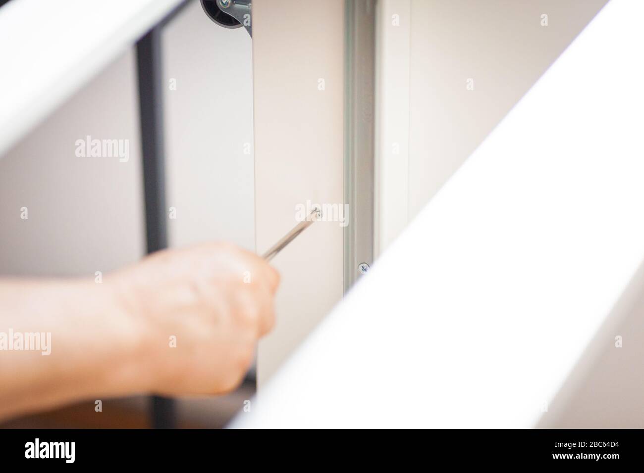 Diy furniture assembly using manual screwdriver Stock Photo - Alamy