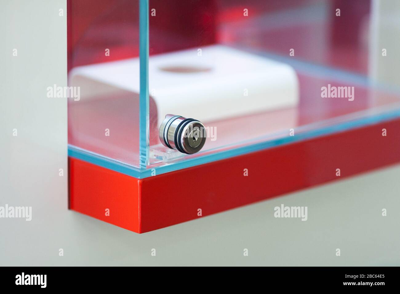 Shop secured glass window shelf with anti theft locks Stock Photo - Alamy