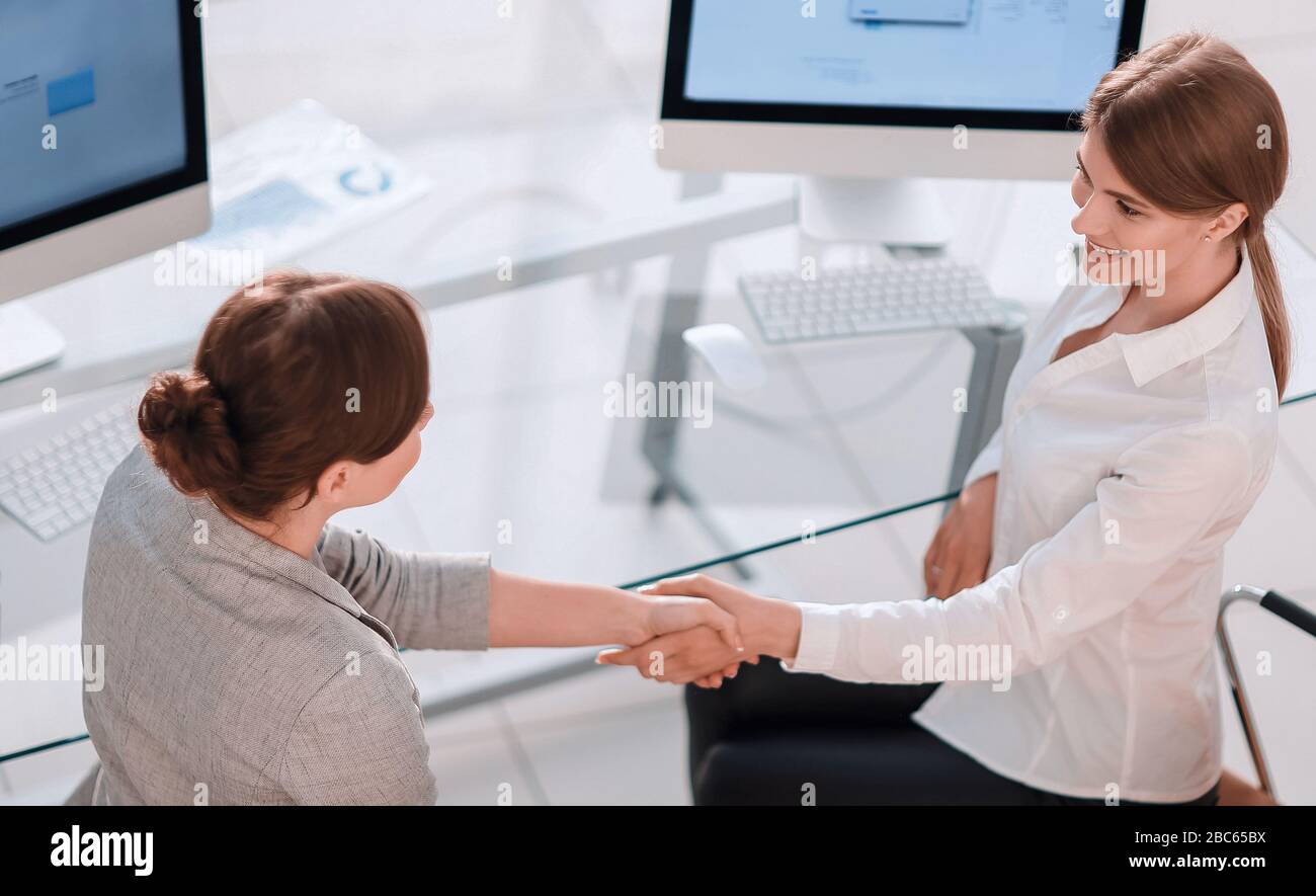 Confident woman shakes hands hi-res stock photography and images - Alamy