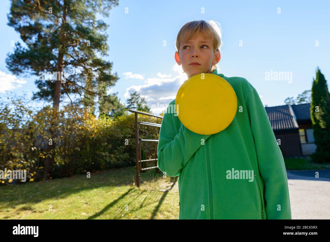 Boy holding frisbee hi-res stock photography and images - Alamy