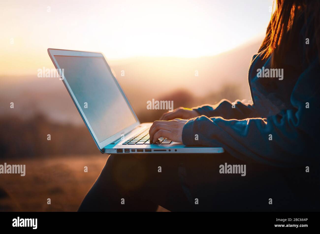 Using laptop computer in nature, technology and freedom concept Stock ...