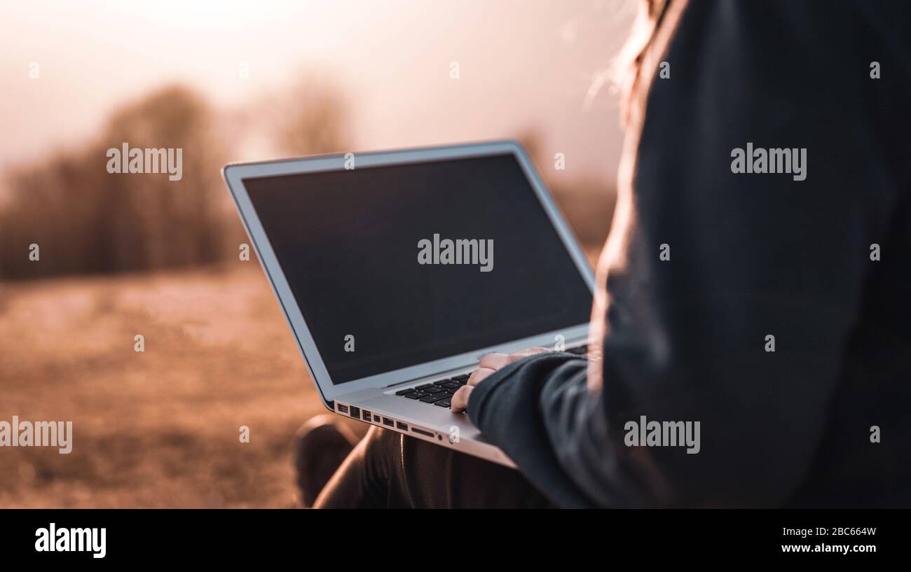 Using laptop computer in nature, technology and freedom concept Stock ...