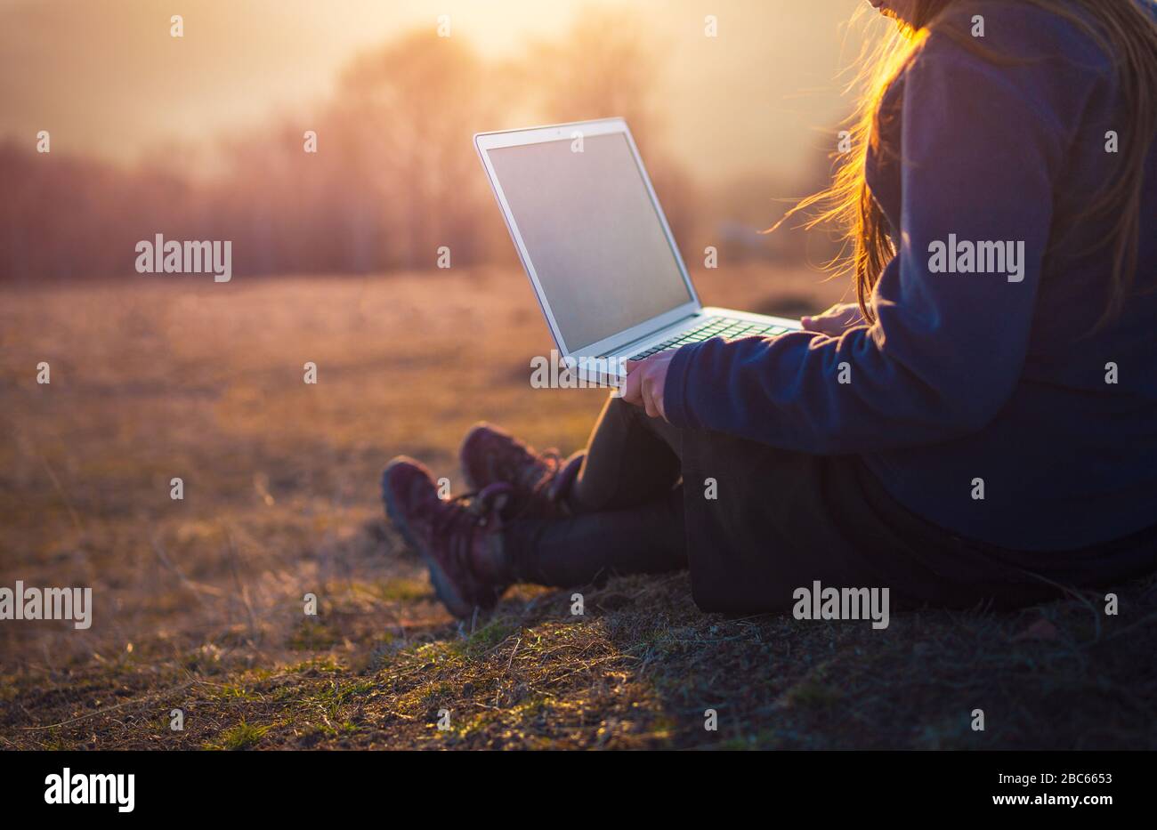 Using laptop computer in nature, technology and freedom concept Stock ...