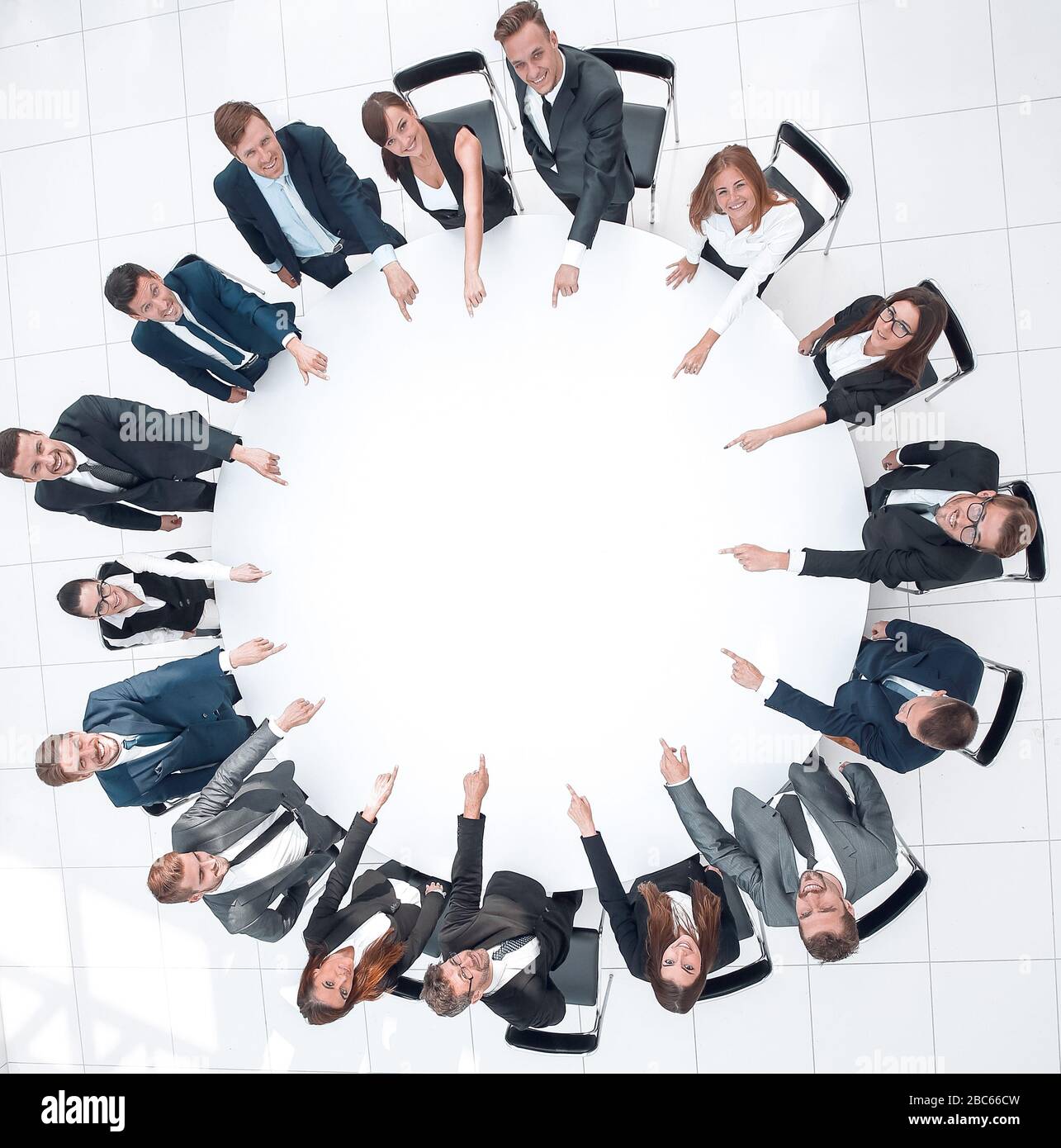 closeup .business team pointing in the center of the table Stock Photo ...
