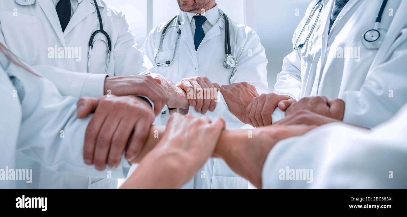 close up.a group of doctors standing in a circle Stock Photo - Alamy