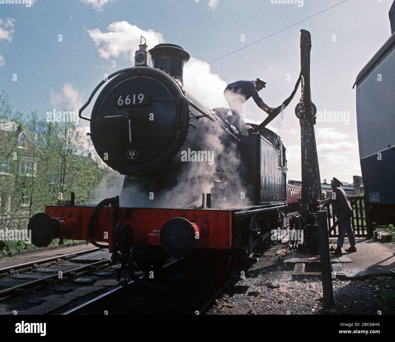 Steam locomotive taking on water at Pickering station, North Yorkshire ...