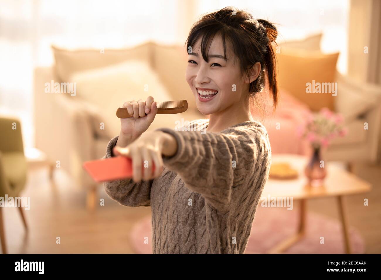 Young Chinese woman having fun at home Stock Photo - Alamy