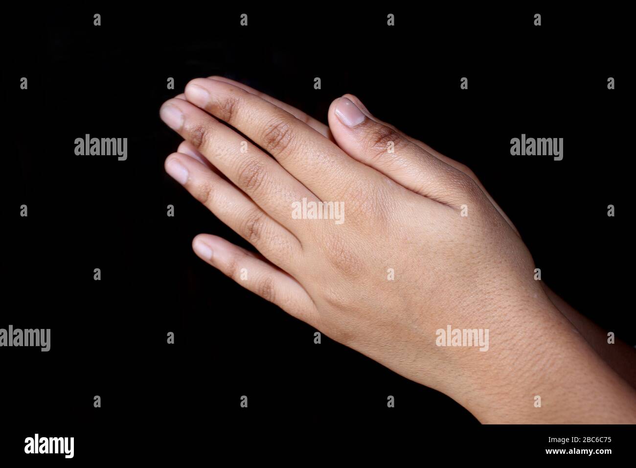 close up both of hand doing prayer, closed hand, symbol of request on ...